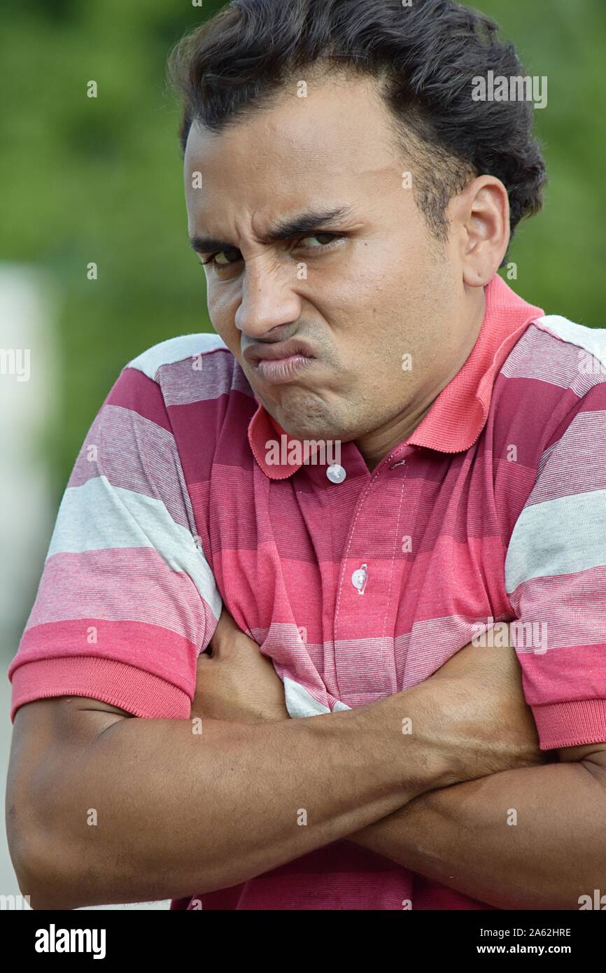 Stubborn Young Colombian Male Stock Photo - Alamy