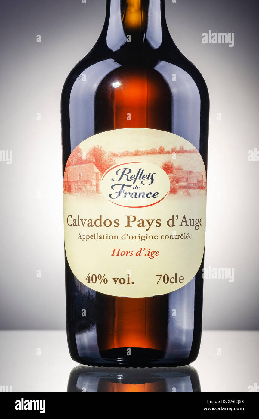 Bottle of calvados on gradient background. Calvados is kind of apple ...