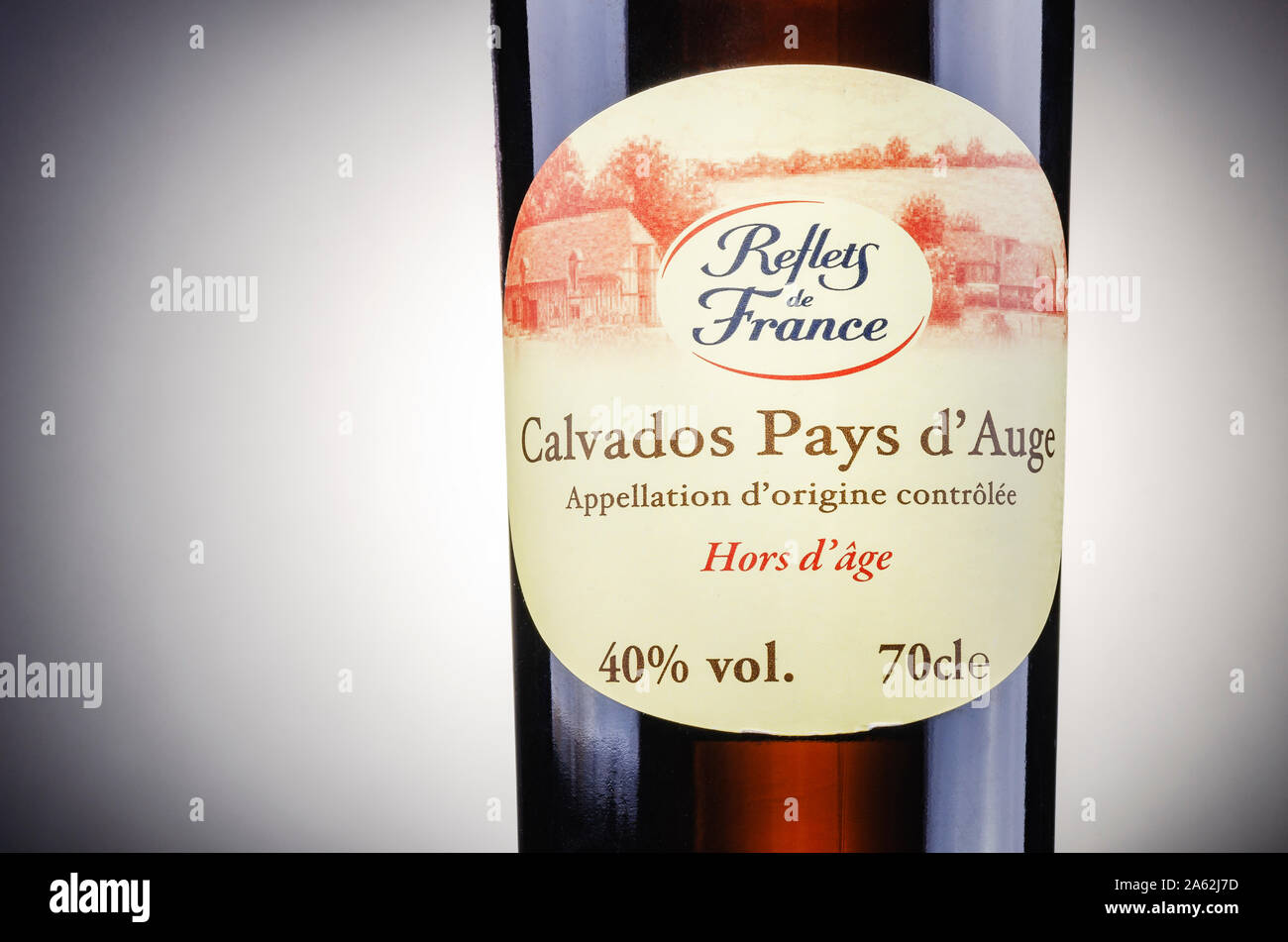 Bottle of calvados on gradient background. Calvados is kind of apple ...