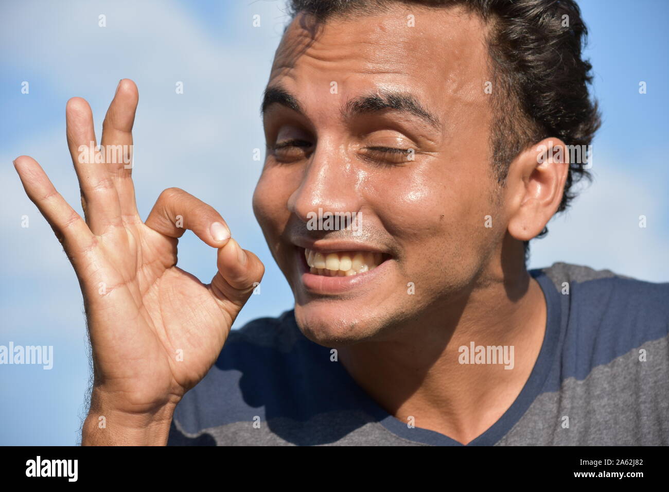 Latino Male And Okay Sign Stock Photo - Alamy
