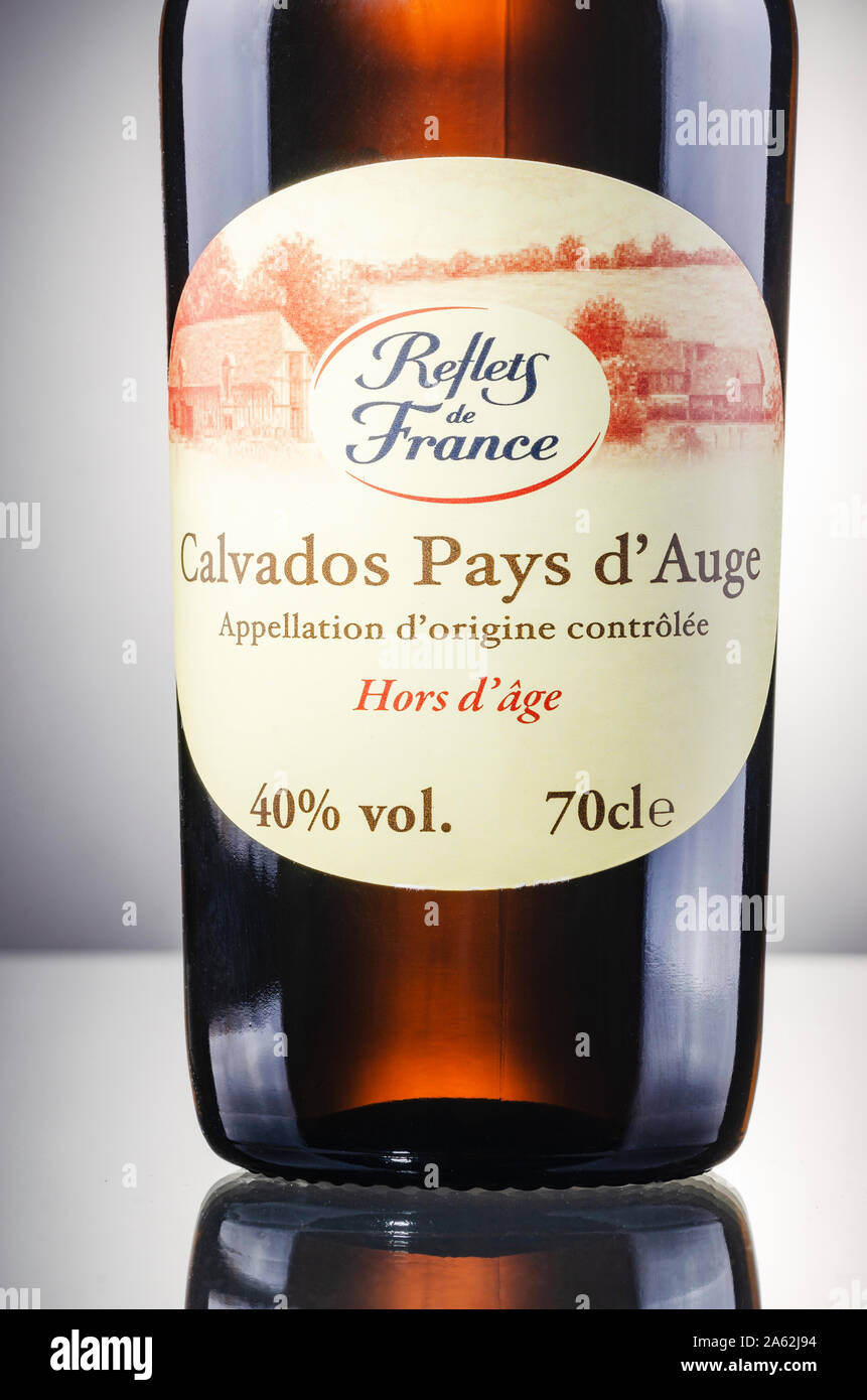 Bottle of calvados on gradient background. Calvados is kind of apple ...
