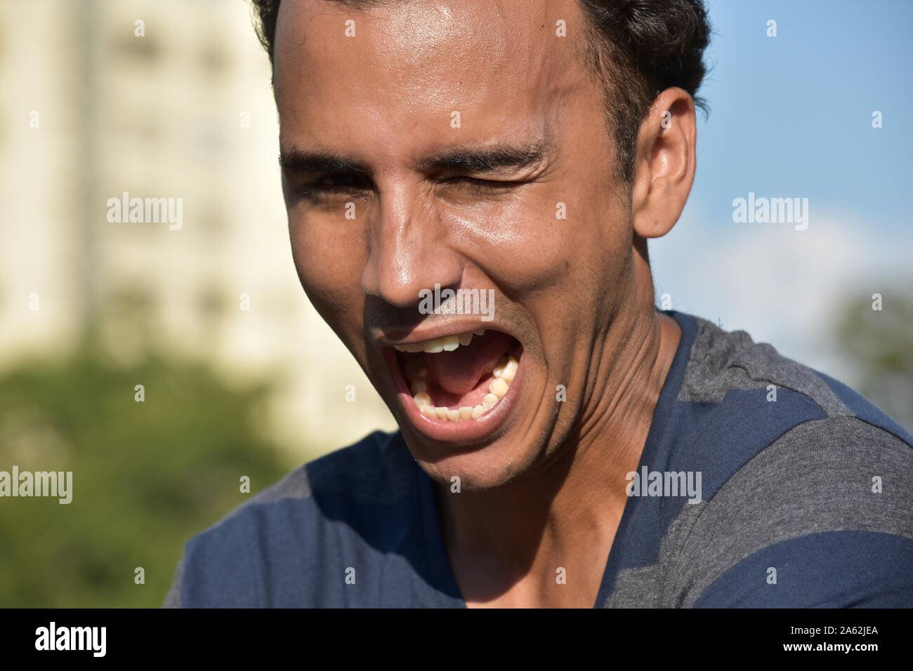 Young Male Winking Stock Photo - Alamy