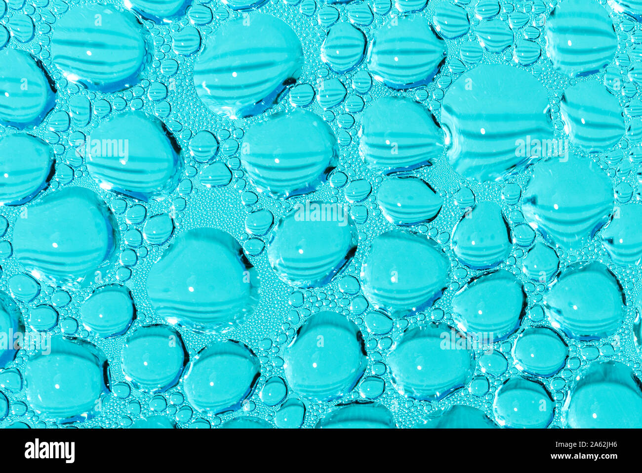 Blue swimming pool water drops and bubbles detail Stock Photo - Alamy