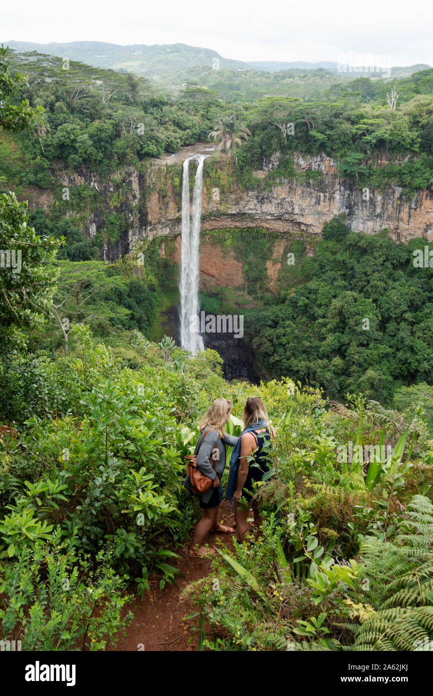 Mauritius travel; tourists looking at the Chamarel waterfall, Chamarel ...