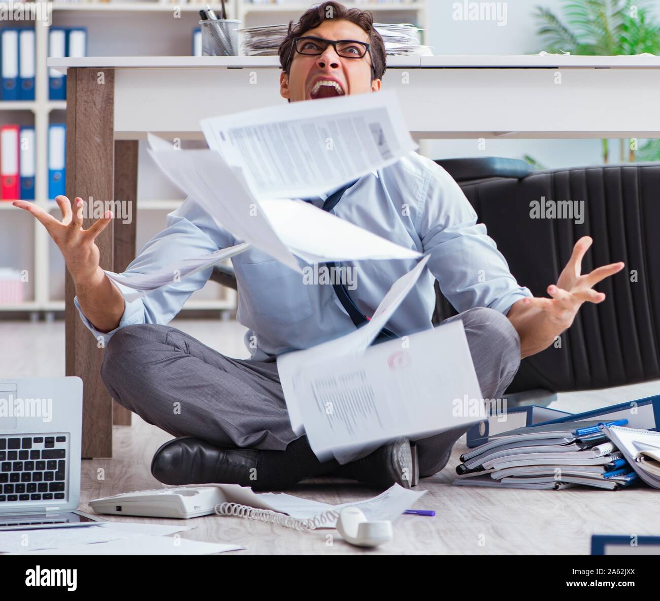 The bankrupt businessman angry in the office floor Stock Photo - Alamy