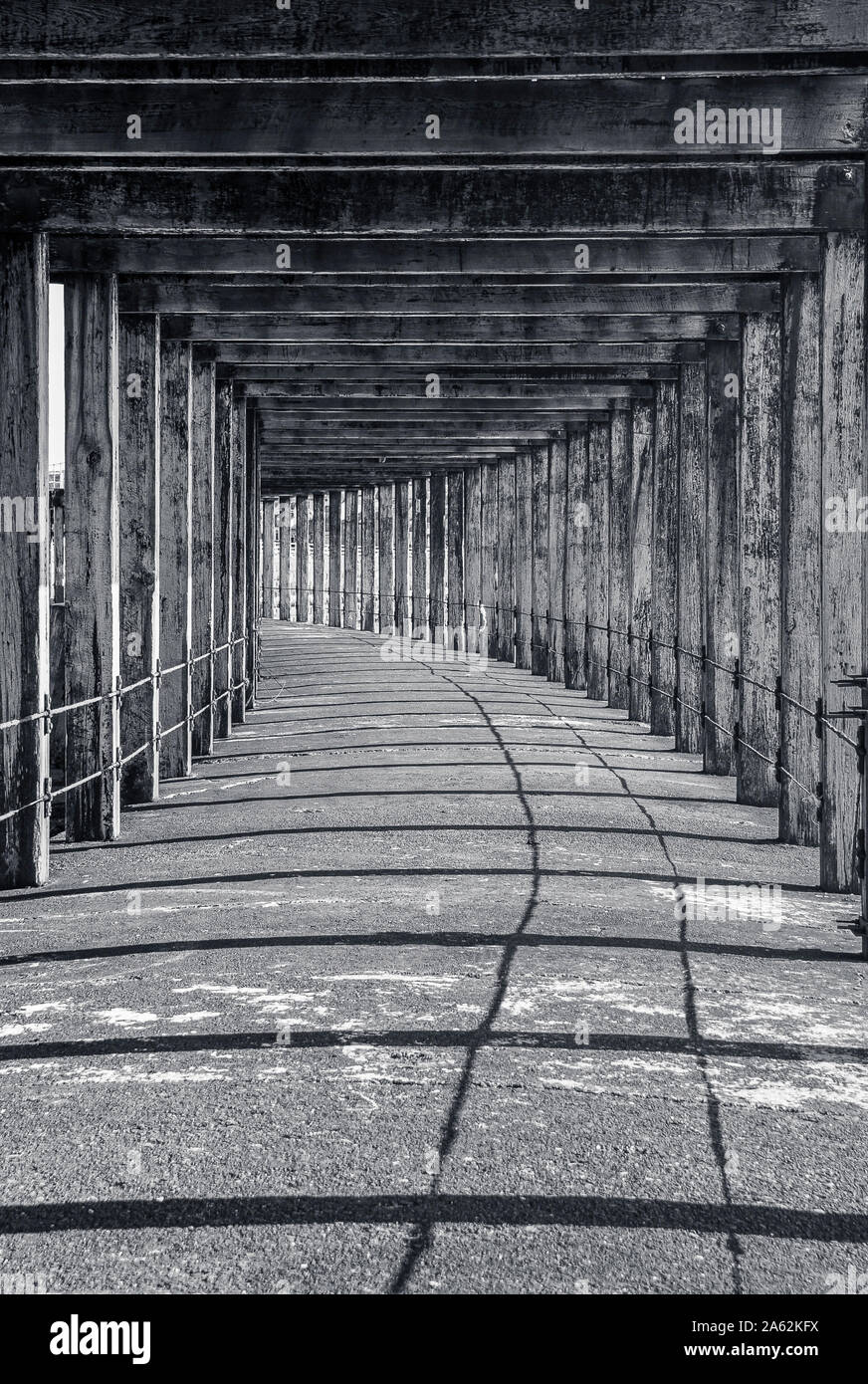 Wooden colonnade walkway underneath the pier in Whitby Stock Photo - Alamy