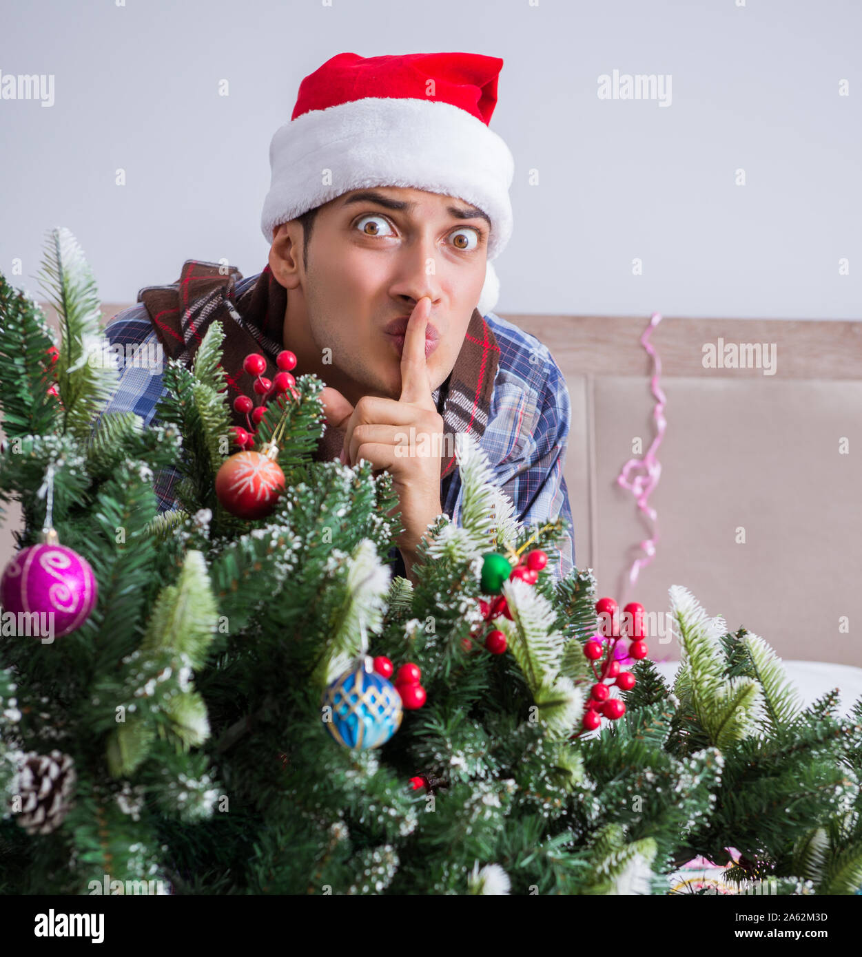 The man suffering hangover after christmas party Stock Photo - Alamy