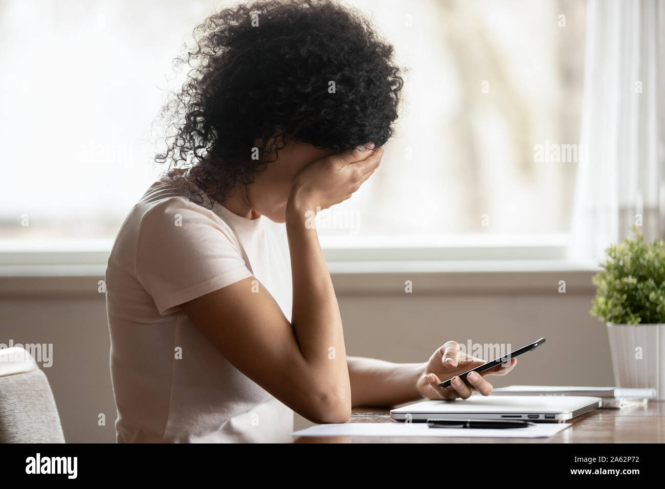 Depressed sad millennial african ethnic woman received bad news Stock ...