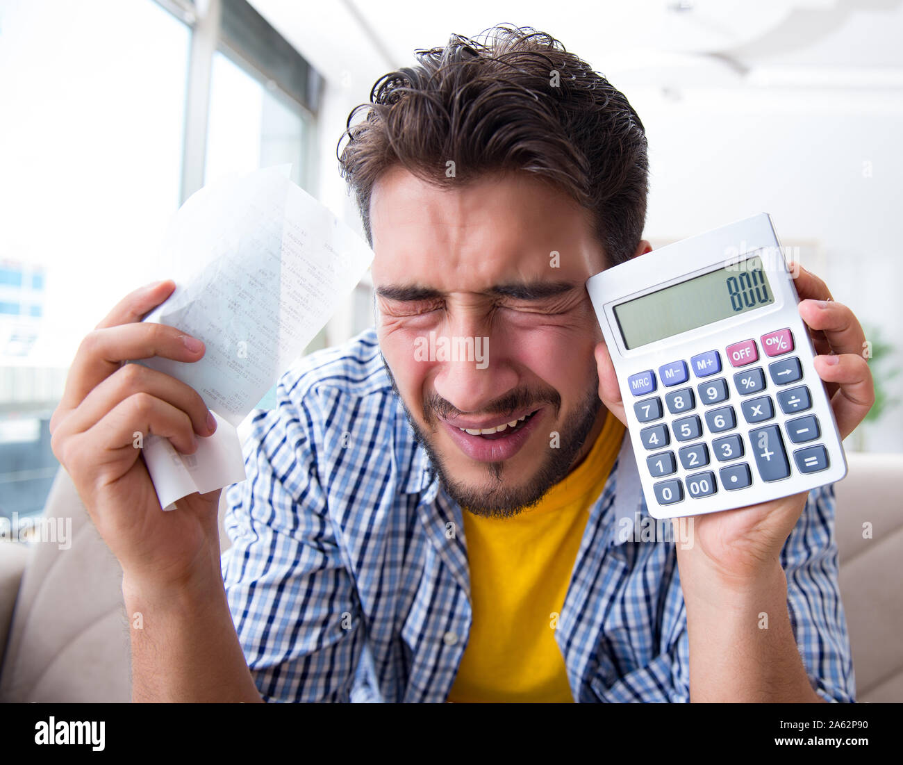 The man angry at bills he needs to pay Stock Photo - Alamy