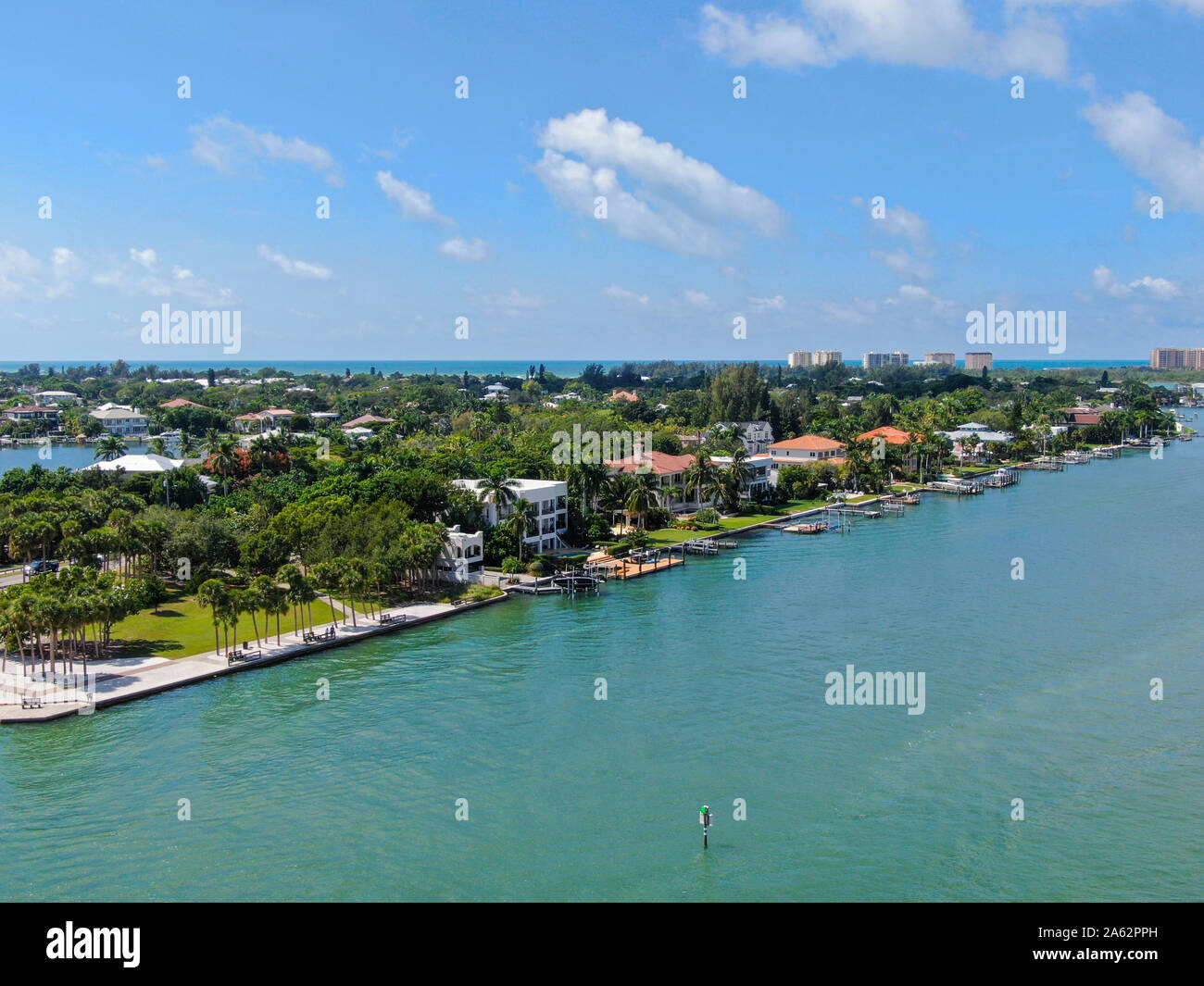 Aerial view of Bay Island neighborhood and luxury villas next the ocean ...