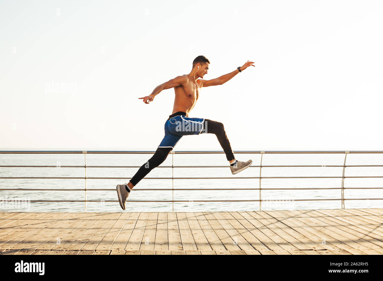 Athlete makes dynamic jump hi-res stock photography and images - Alamy