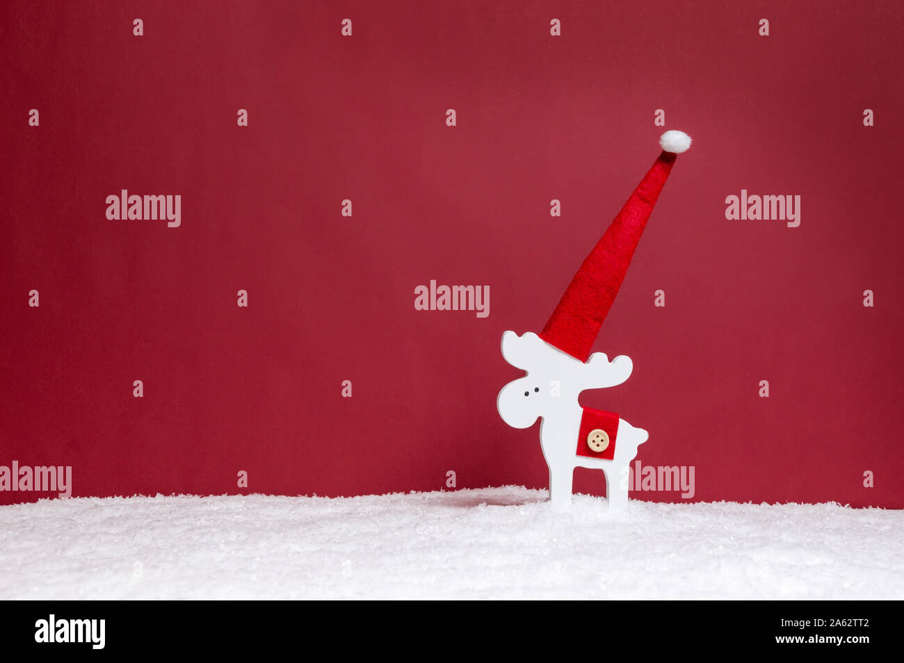 Minimalist Christmas holiday concept with white wooden reindeer in ...