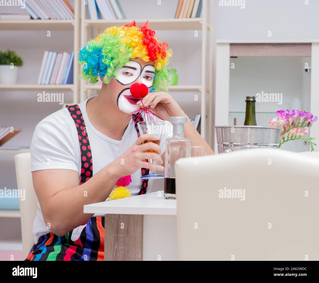 The drunk clown celebrating having a party at home Stock Photo - Alamy