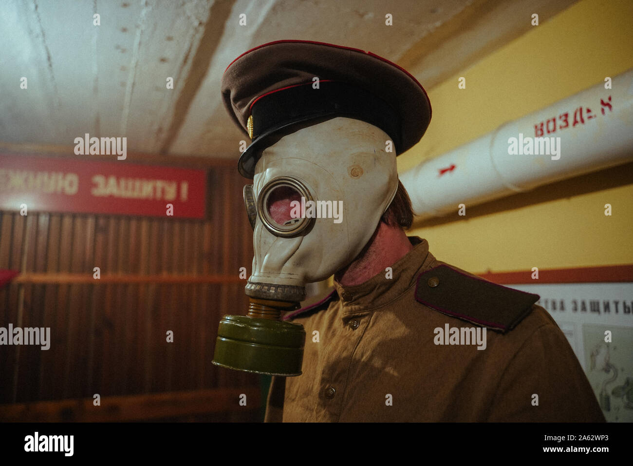 Soviet times military man with white gas mask in the headquarters ...