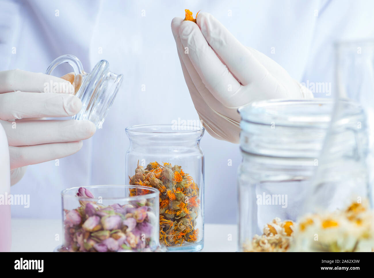 The chemist mixing perfumes in the lab Stock Photo - Alamy