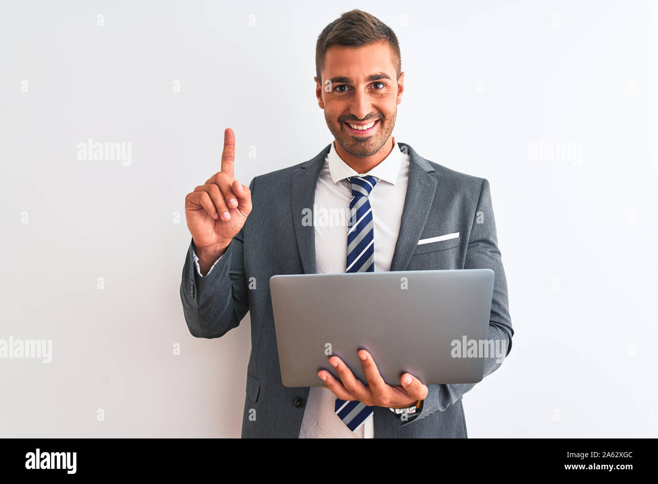 Young handsome business man working using computer laptop over isolated ...