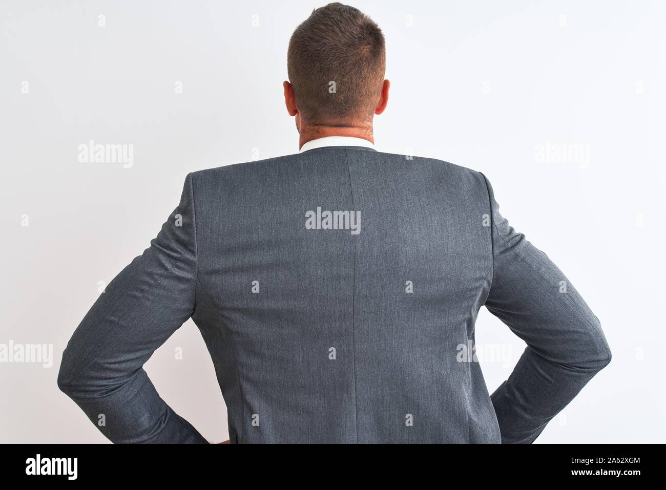 Young handsome business man wearing suit and tie over isolated ...