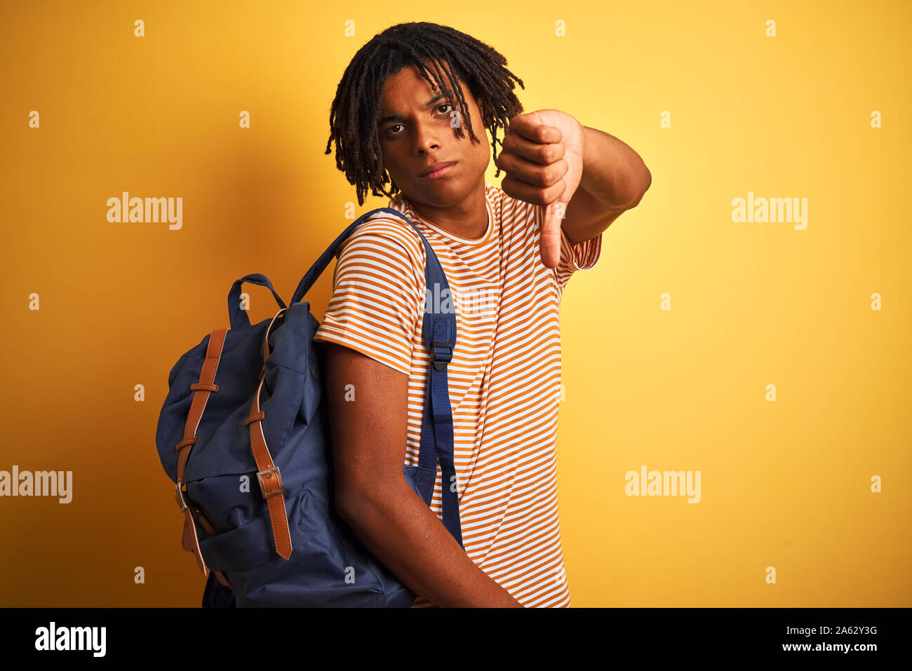 Afro american student man with dreadlocks wearing backpack over ...