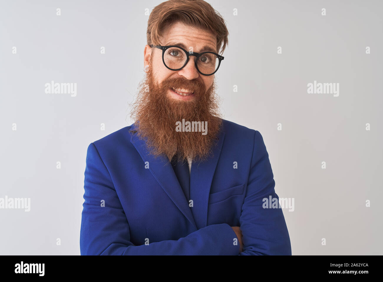 Young redhead irish businessman wearing suit and glasses over isolated ...