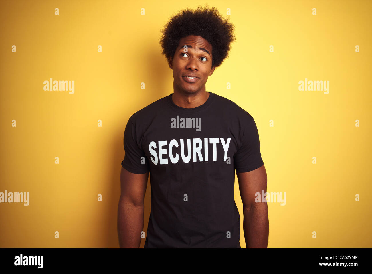 American safeguard man with afro hair wearing security uniform over ...
