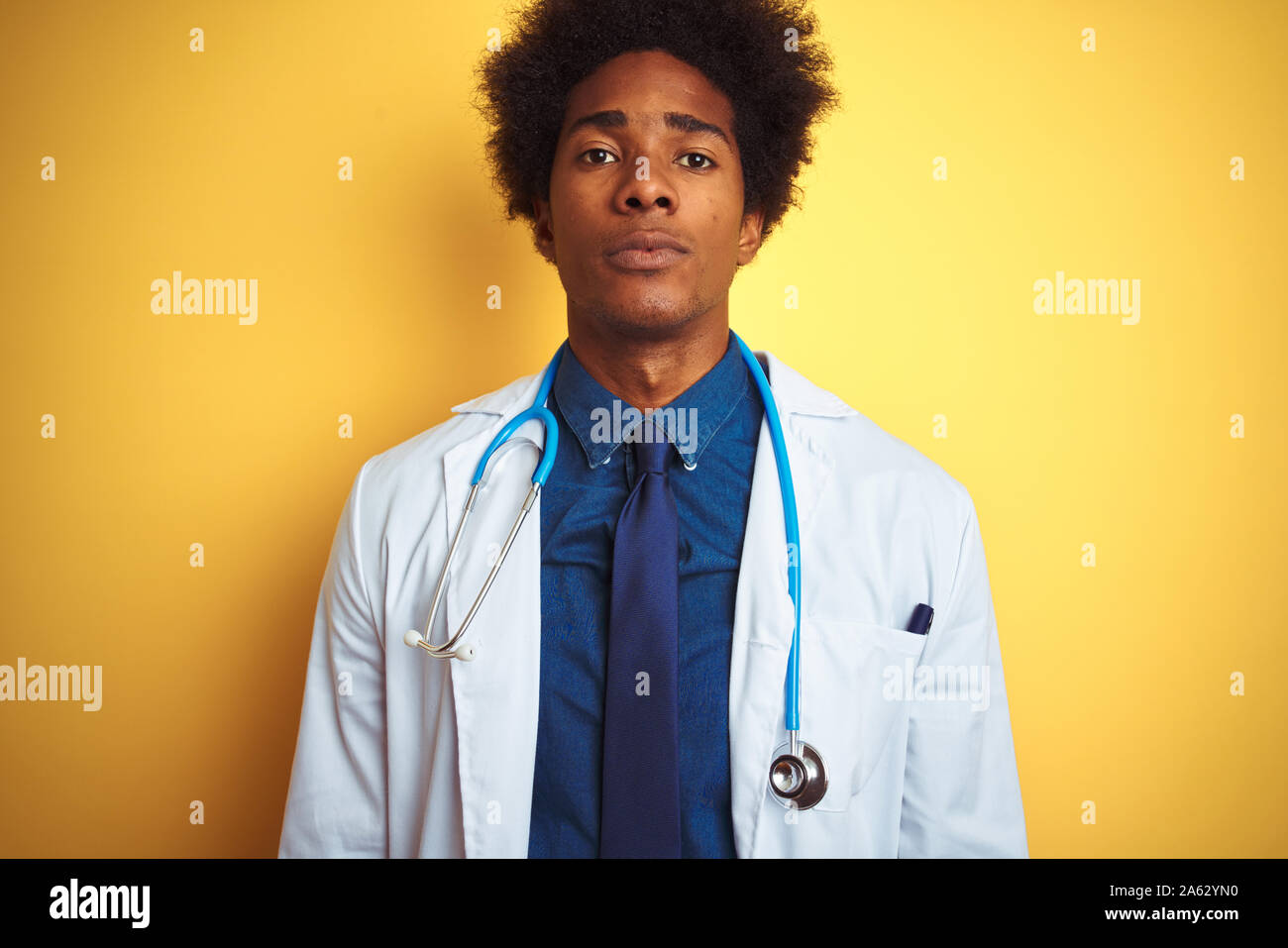 African american doctor man wearing stethoscope standing over isolated ...