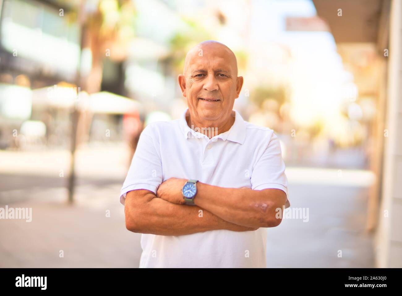 Senior handsome man smiling happy and confident. Standing with smile on ...