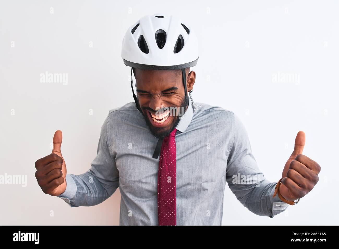 African american businessman with braids wearing bike helmet over ...