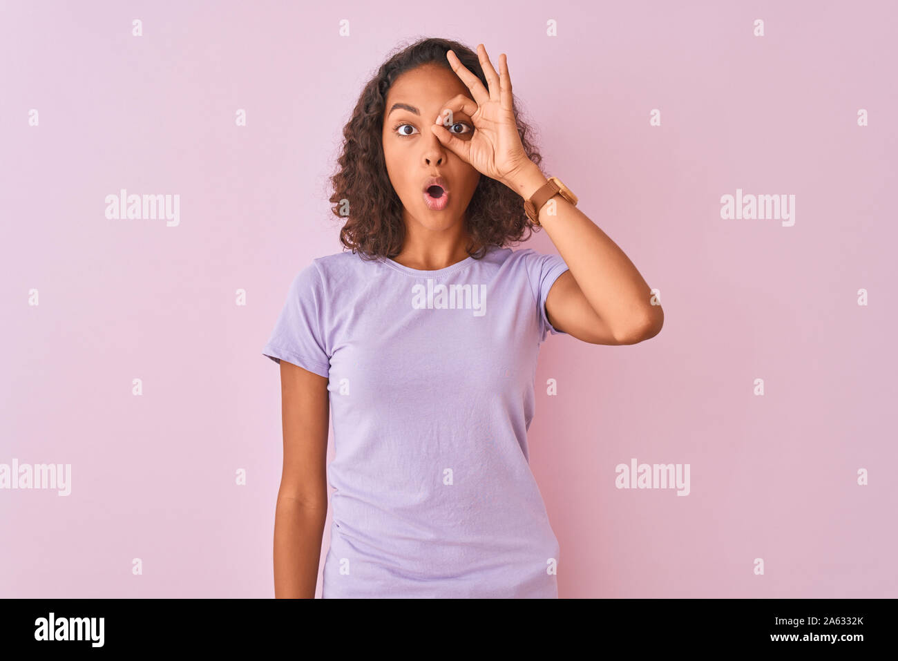 Young Brazilian Woman Wearing T Shirt Standing Over Isolated Pink