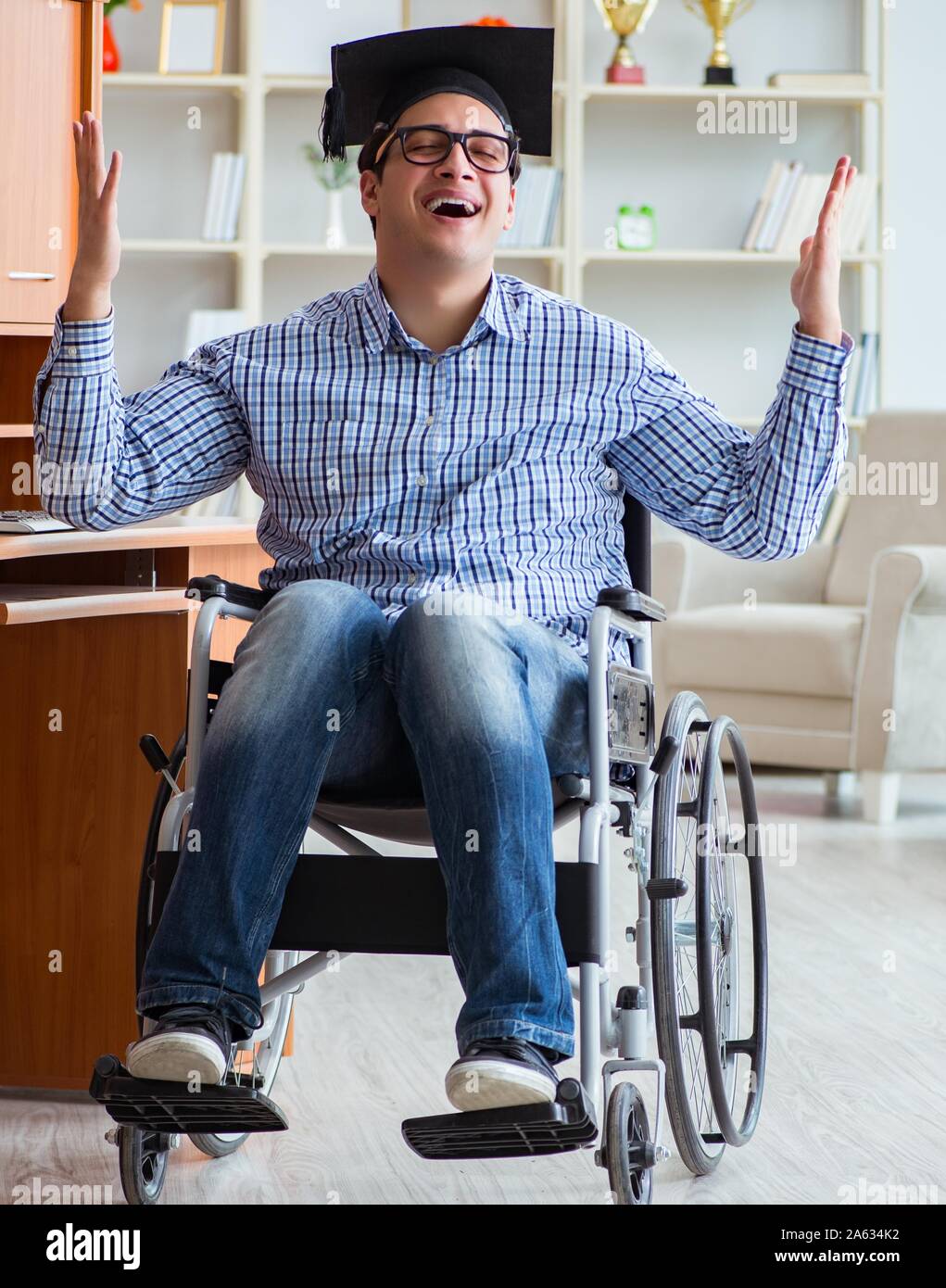 Disabled student studying at home on wheelchair Stock Photo - Alamy