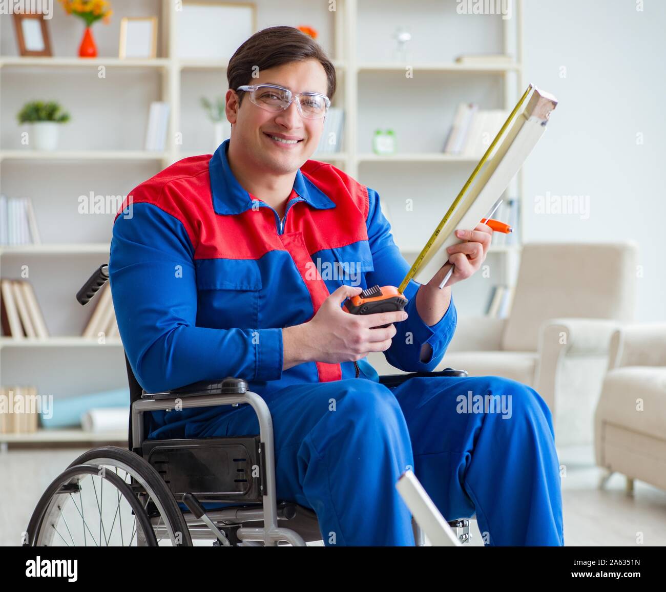 The disabled man measuring with meter Stock Photo - Alamy