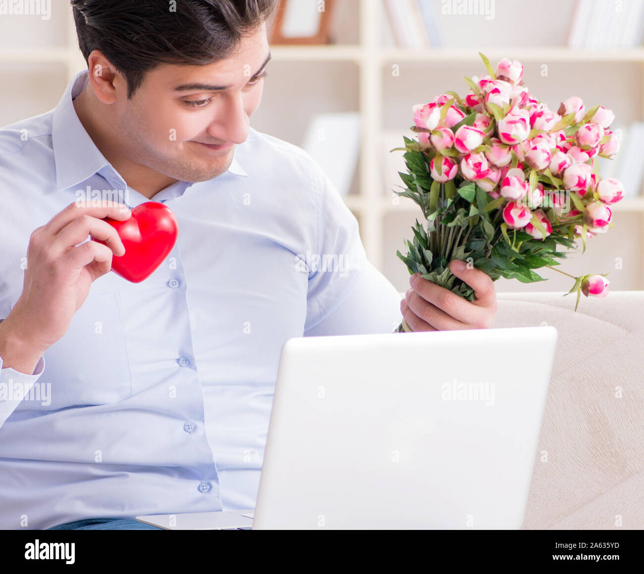 The young man making marriage proposal over internet laptop Stock Photo ...