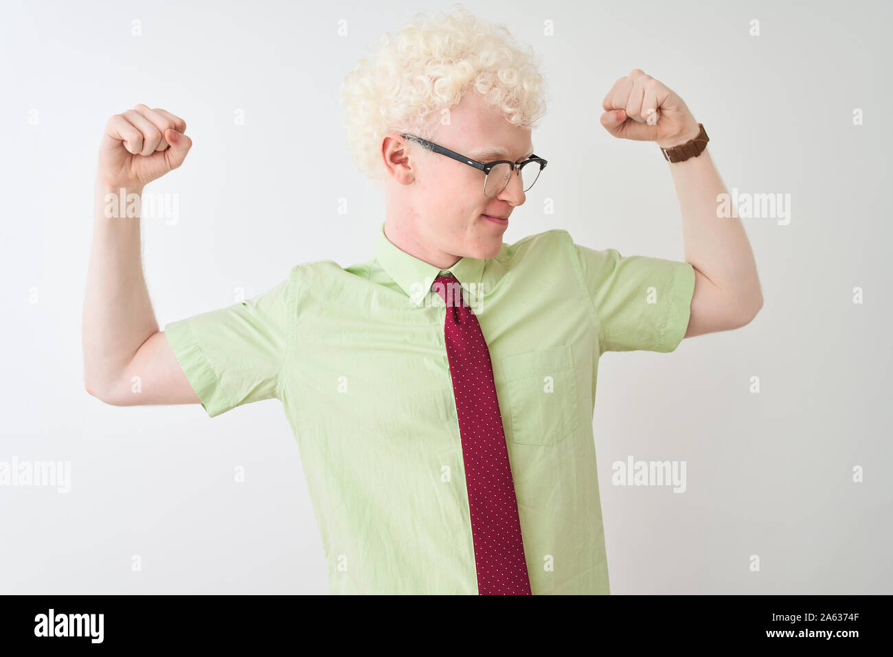 Young albino businessman wearing shirt and tie standing over isolated ...