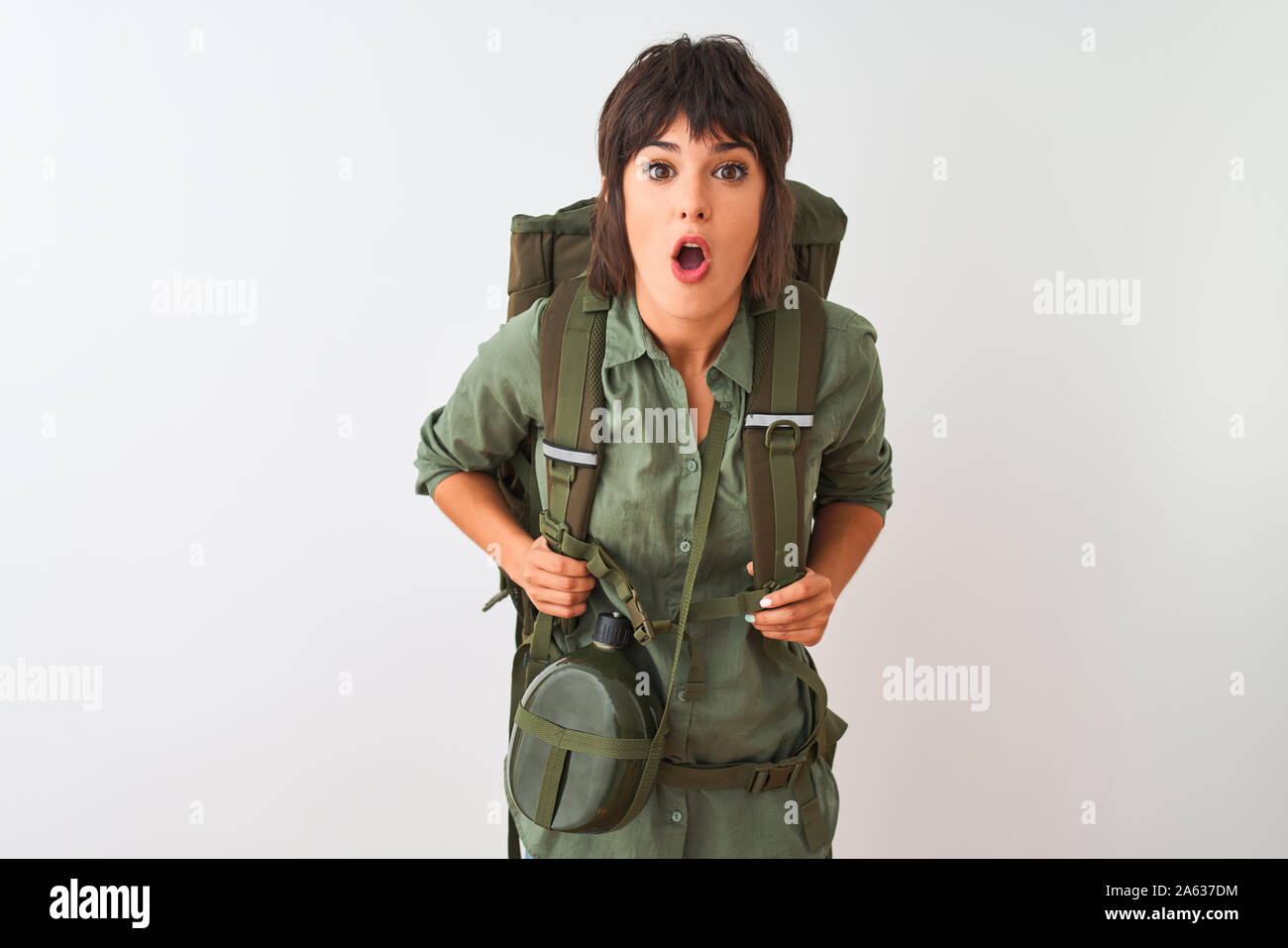 Beautiful hiker woman wearing backpack and water canteen over isolated ...
