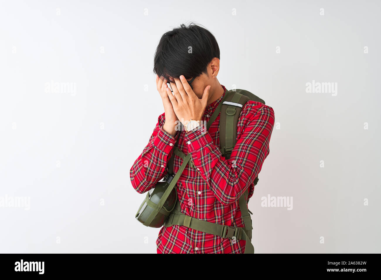 Chinese hiker man wearing backpack canteen glasses over isolated white ...