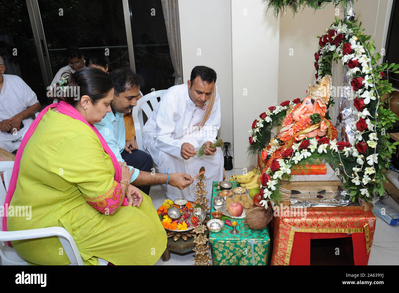 Devotee performing puja hi-res stock photography and images - Alamy