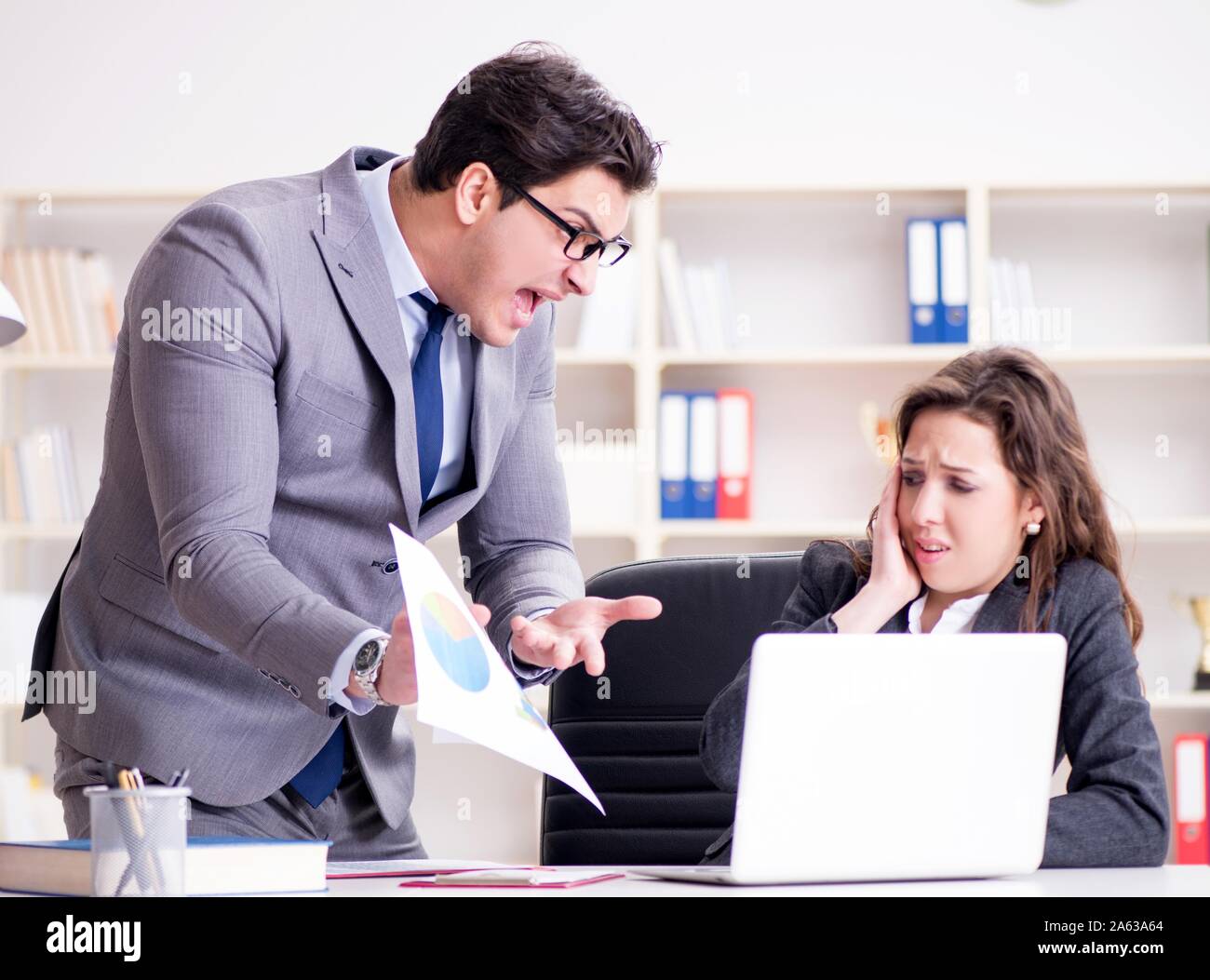The angry boss unhappy with female employee performance Stock Photo - Alamy