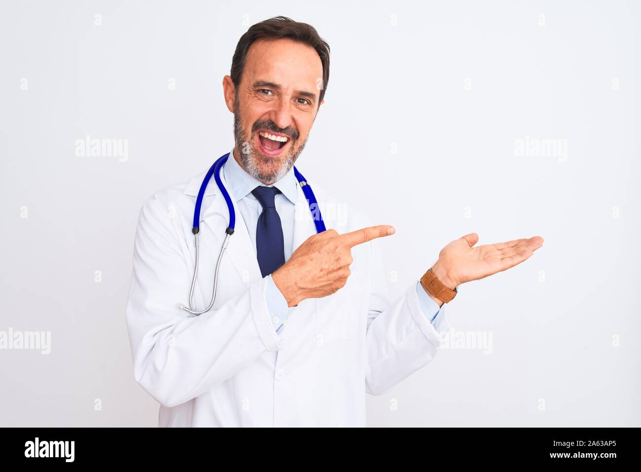 Middle age doctor man wearing coat and stethoscope standing over ...