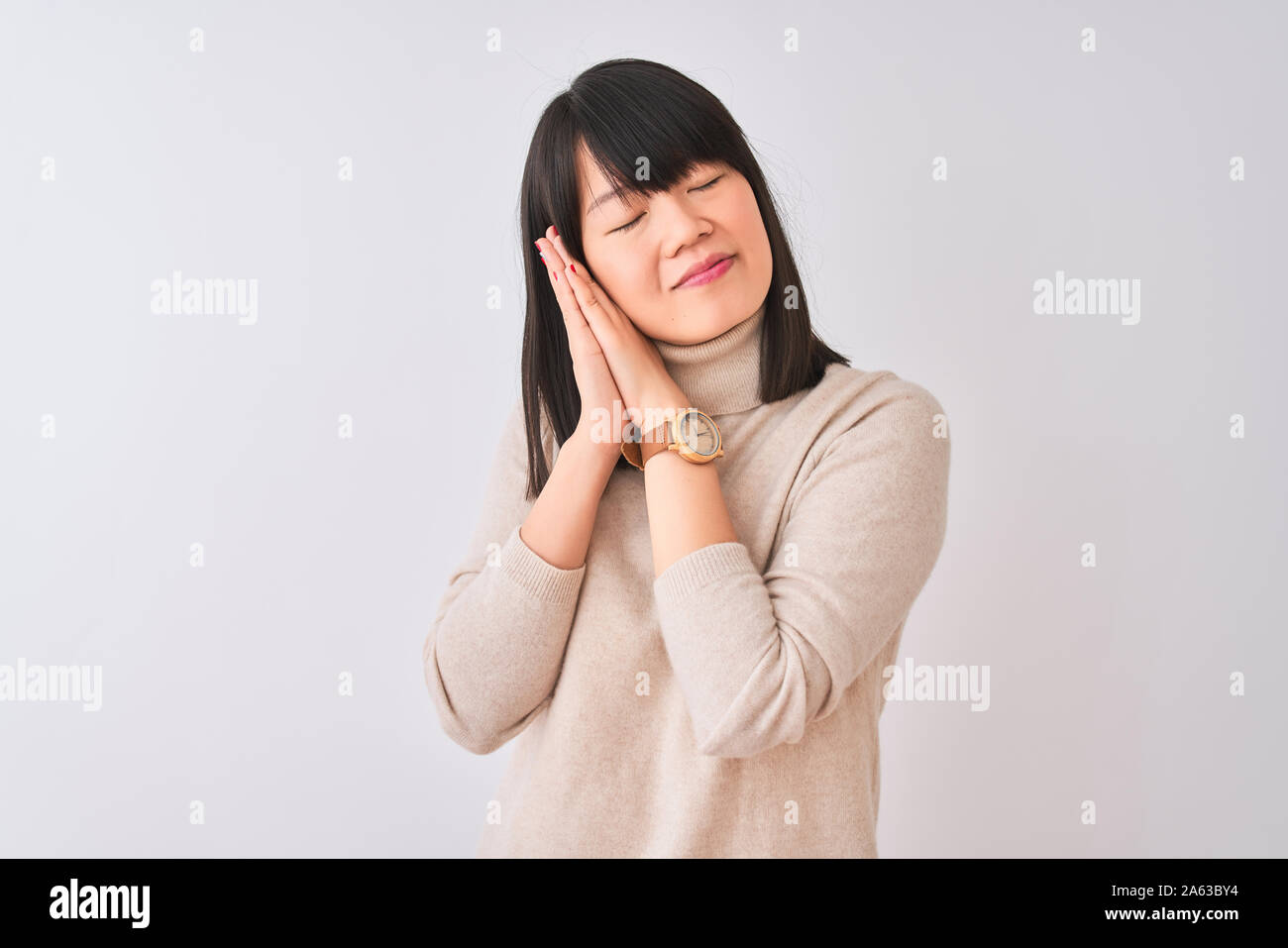 Young beautiful chinese woman wearing turtleneck sweater over isolated ...