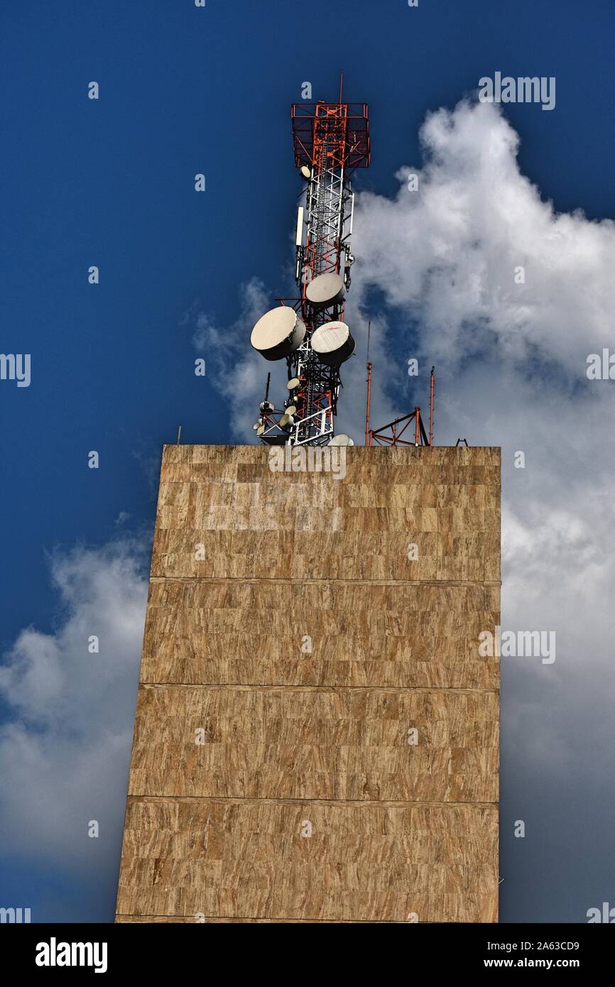 Building And Cell Communications Tower Stock Photo - Alamy