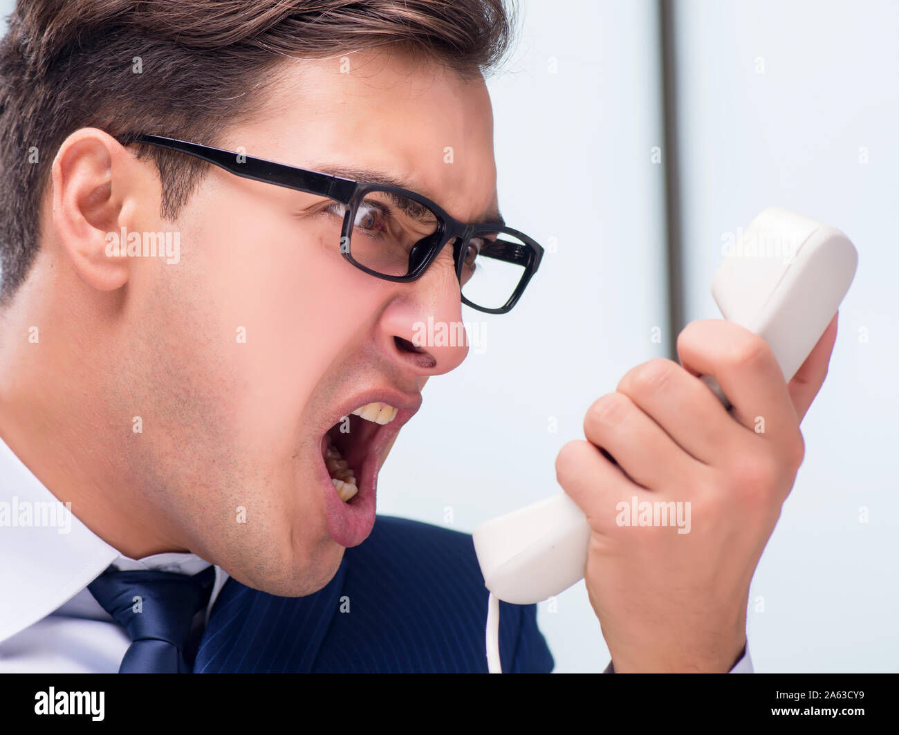 Angry helpdesk operator yelling hi-res stock photography and images - Alamy