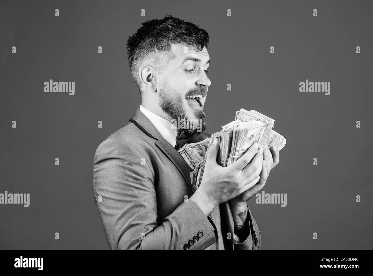 Businessman got cash money. Gain real money. Richness and wellbeing ...