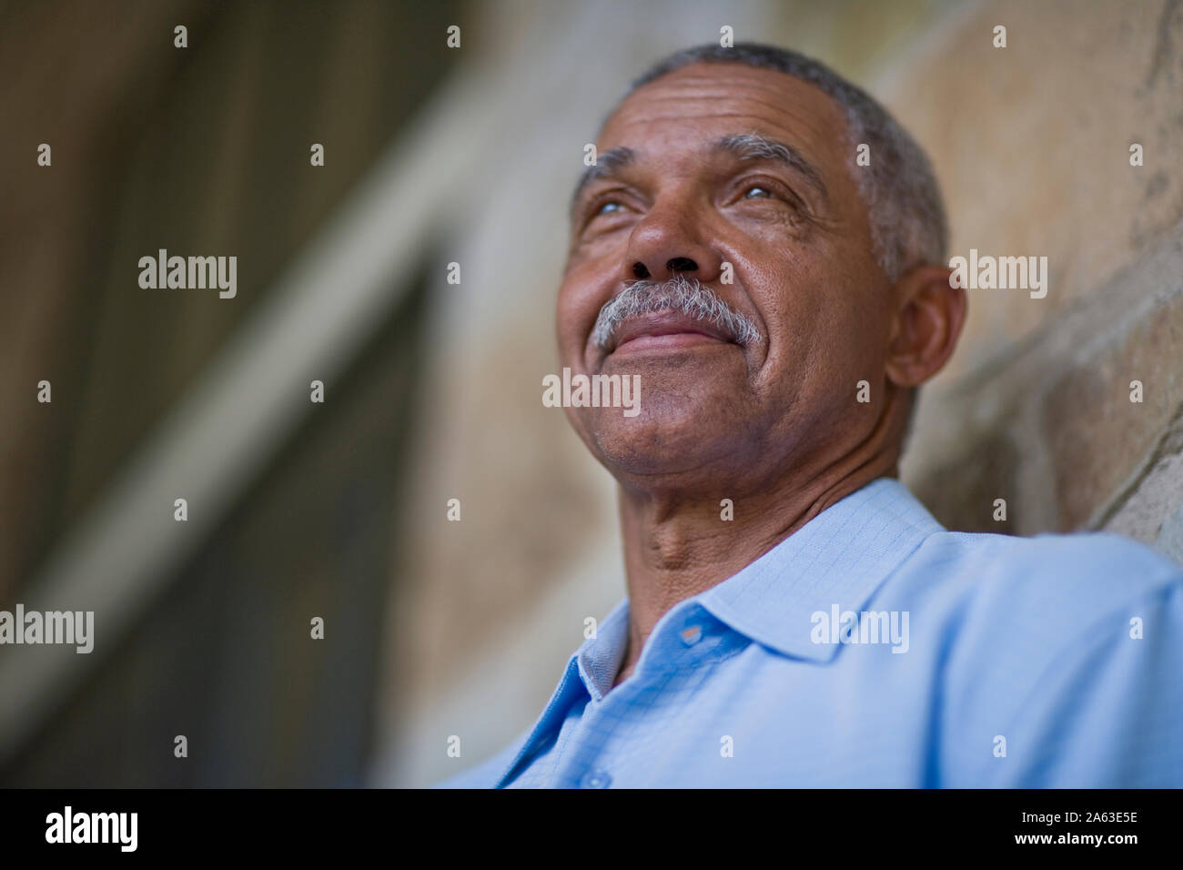 Portrait of a senior man looking content Stock Photo - Alamy