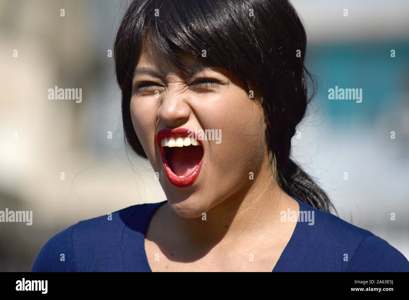 Hispanic Female Yelling Stock Photo - Alamy