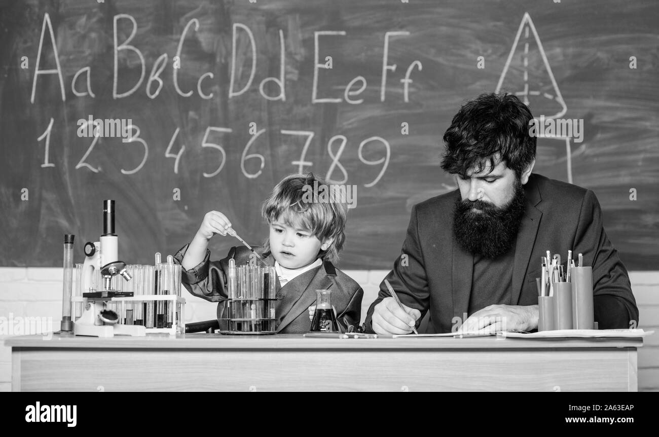 Formula. experiments in organic chemistry laboratory. small boy with ...