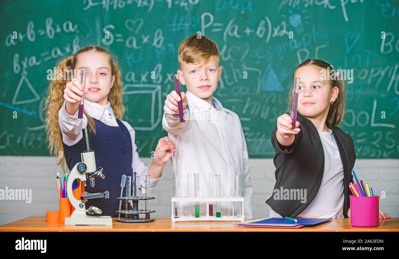 For a better tomorrow. Lab microscope and testing tubes. Chemistry ...