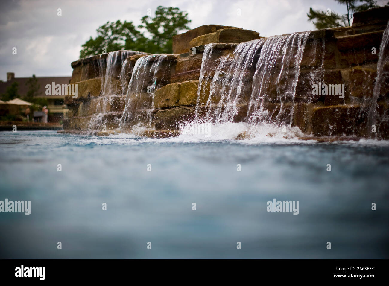 Swimming pool waterfall Stock Photo - Alamy