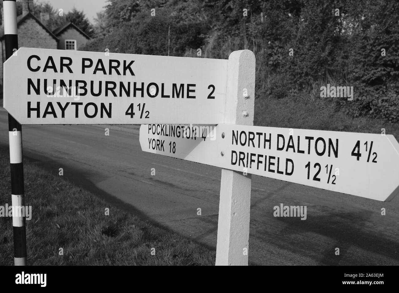 Old Style Village Direction Sign Stock Photo - Alamy