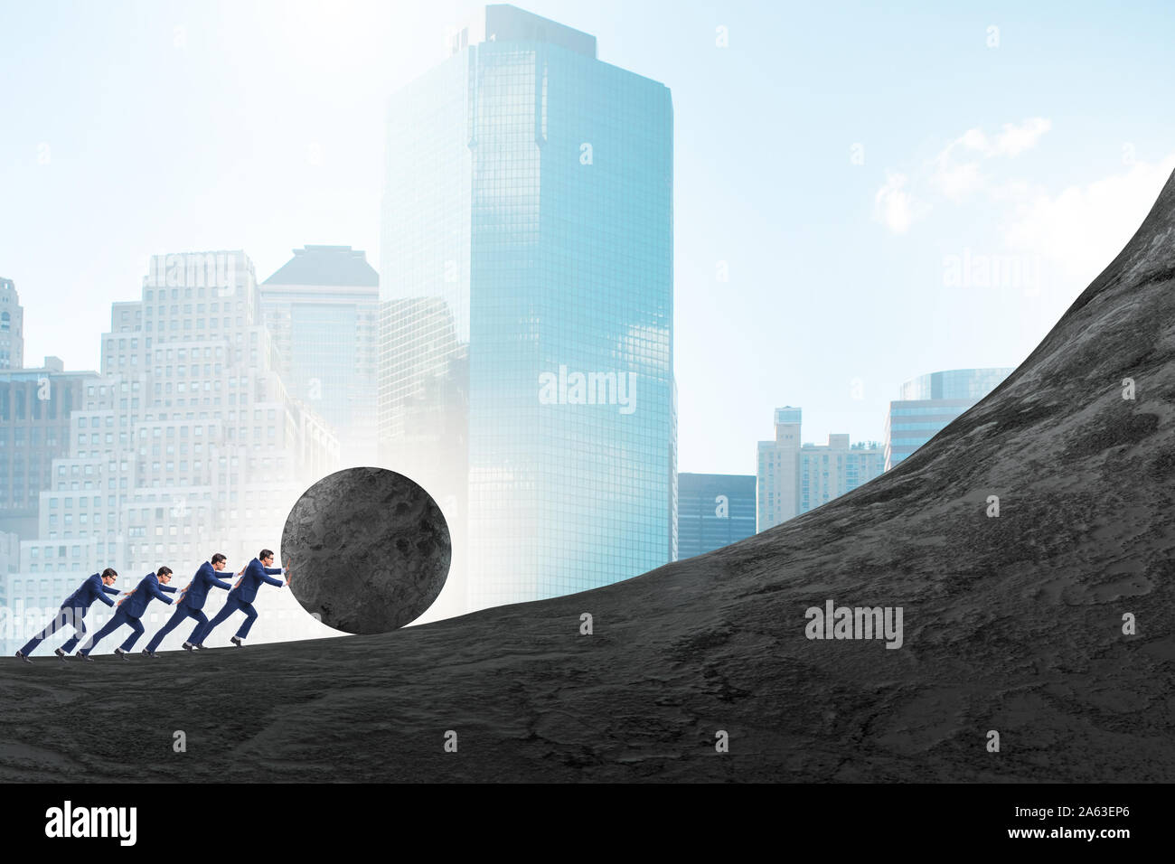 The team of people pushing stone uphill Stock Photo - Alamy