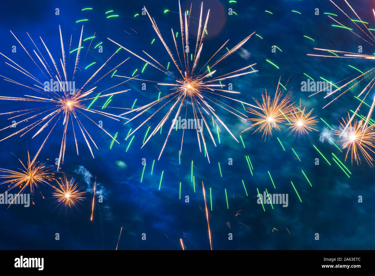 Inexpensive fireworks over the city red, green and yellow on the blue ...