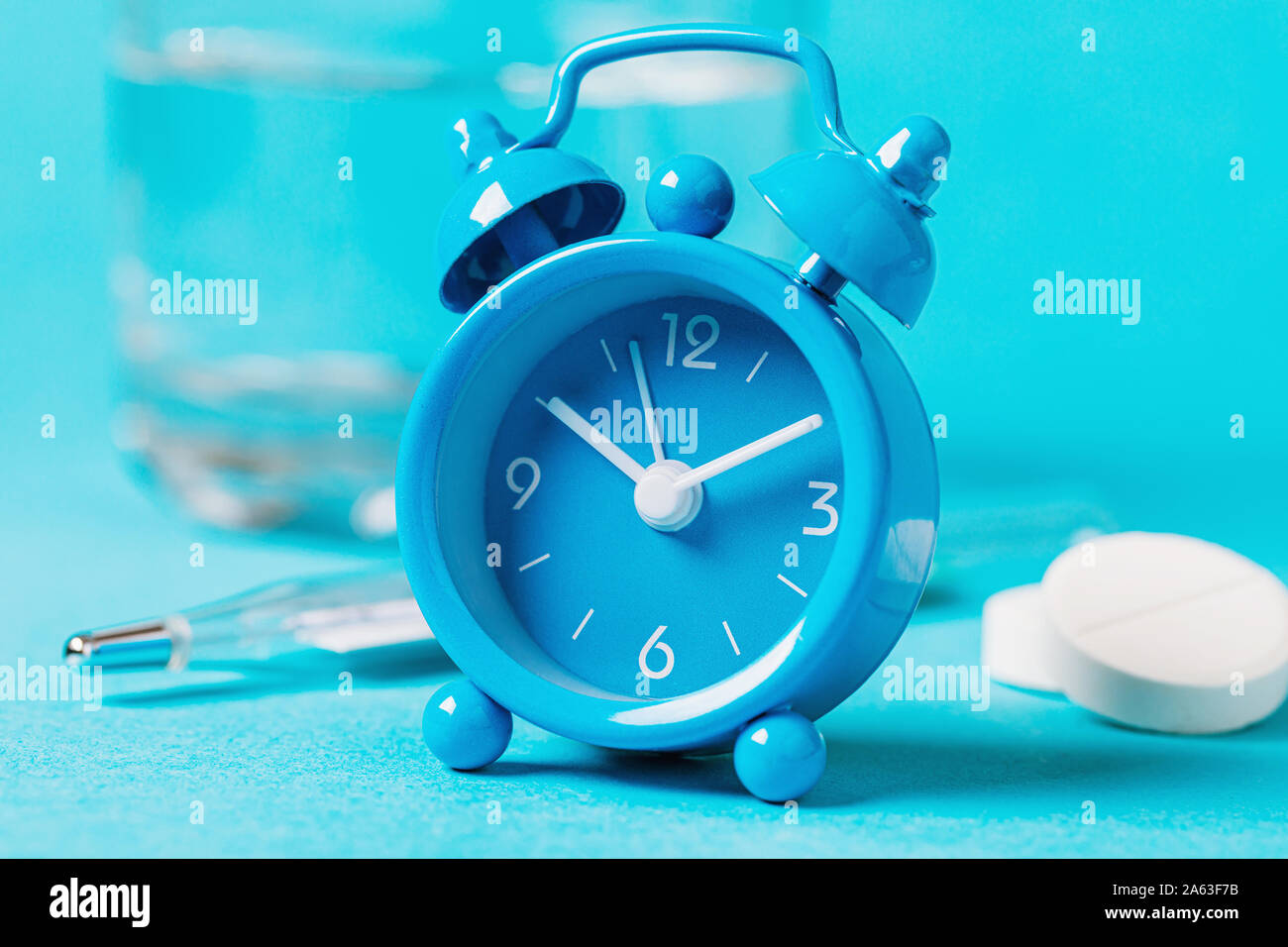 Its time to take the medicine. Concept on the theme of health. Alarm ...